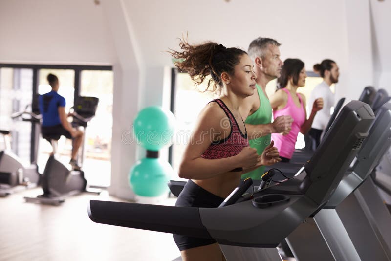 People Using Equipment in Busy Gym Stock Photo - Image of native ...