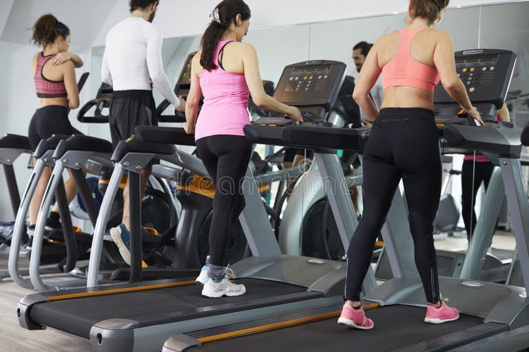 People Using Equipment in Busy Gym Stock Image - Image of millennial ...