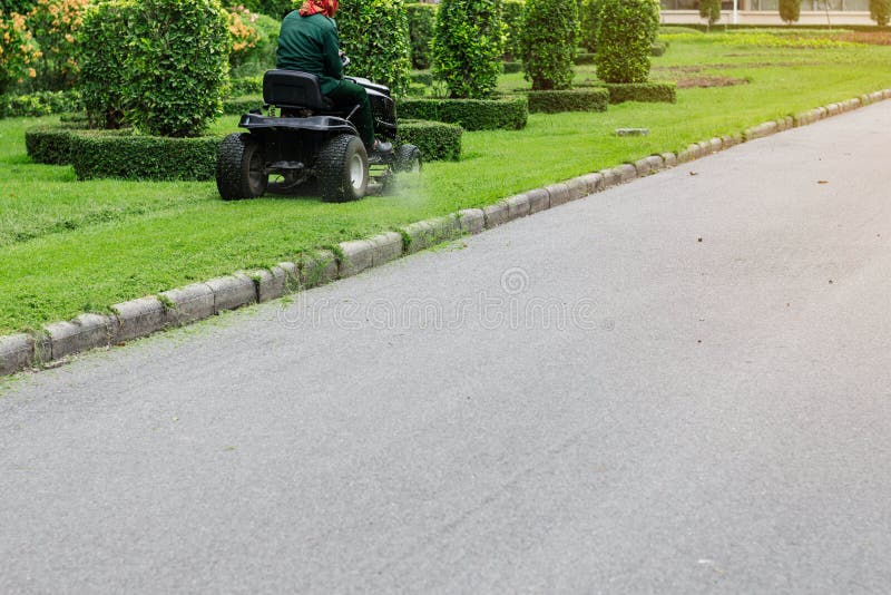 People are Using Lawn Mowers at Walkways. Stock Photo - Image of worker ...
