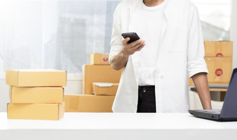 People Using Mobile Phone at Workplace and Preparing Order Store for ...