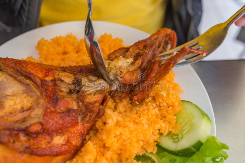 People Using Spoon and Fork Eating Tasty Deep-fried Chicken Rice Stock ...