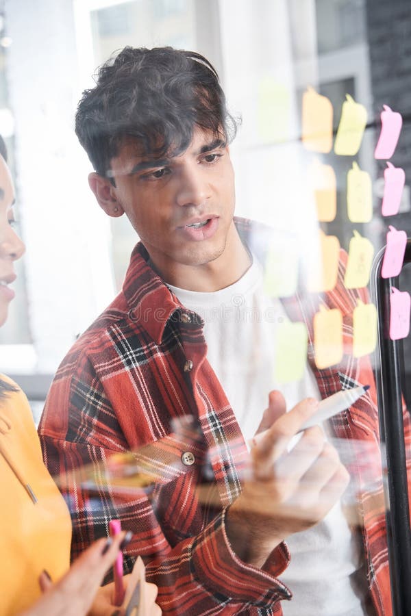 People Using Sticky Note Paper on Glass Wall Stock Image - Image of ...