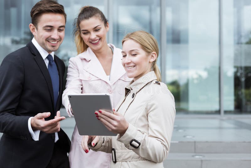 People using tablet stock photo. Image of smiling, outside - 61174850