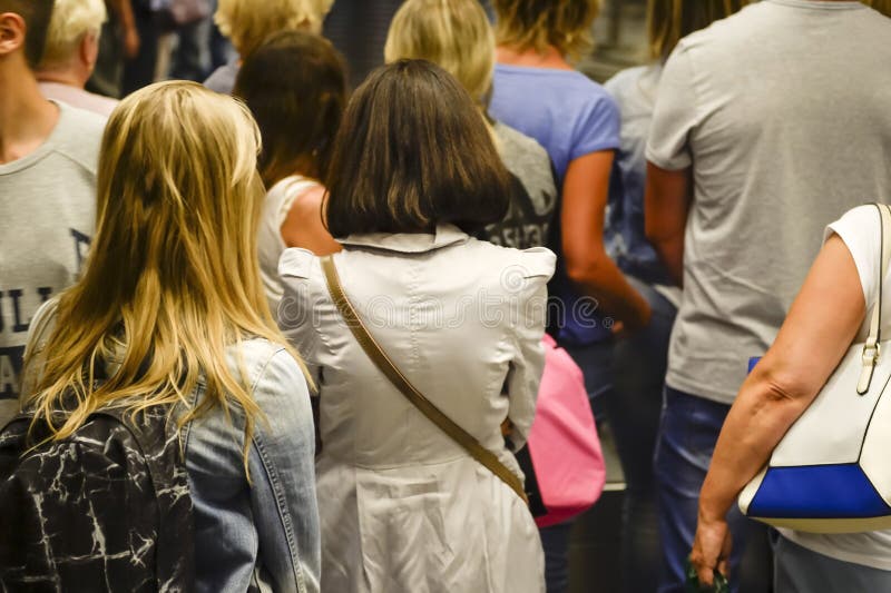 People Wait in Line Seen from Behind. Blurry Editorial Stock Image ...