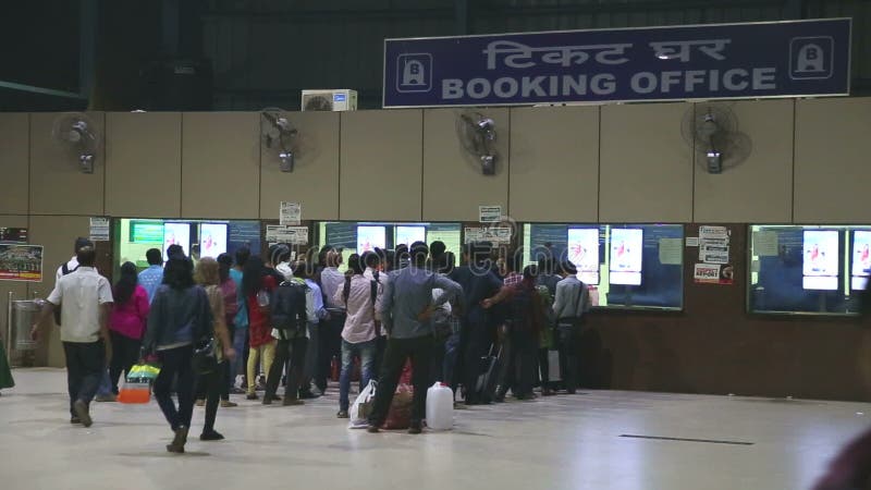 People Waiting in Queue at the Booking Office of a Train Station. Stock ...