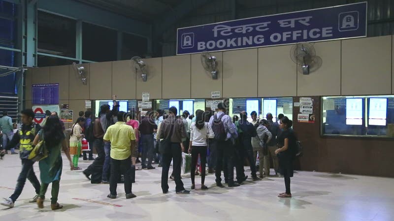 People Waiting in Queue at the Booking Office of a Train Station. Stock ...