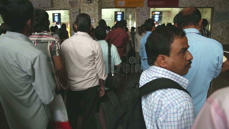 People Waiting in Queue at the Booking Office of a Train Station. Stock ...