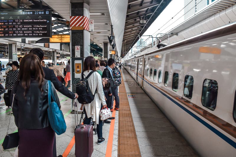 People Waiting for Shinkansen Bullet Train on a Platform in Tokyo Japan ...