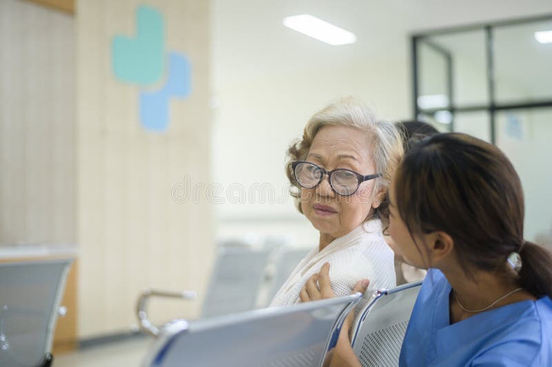 People Waiting To Visit Doctor in Front of Reception in the Hospital ...