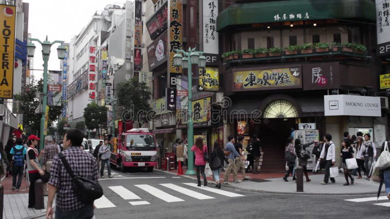 People Walk through a Busy Shopping Intersection in Tokyo Stock Video ...