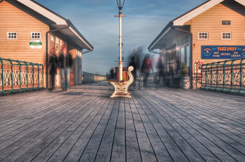 People Walk Past the Bench at Penarth Peir Stock Image - Image of speed ...