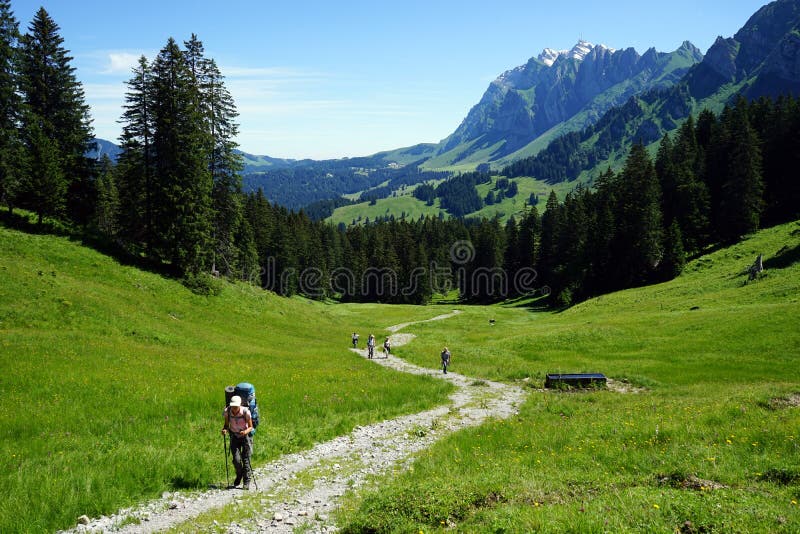 People walk on the track stock photo. Image of backpacker - 76965680