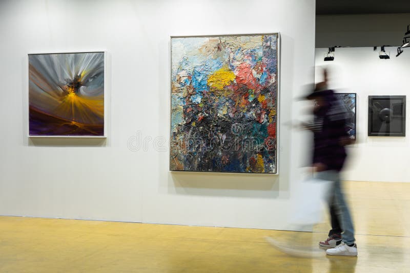 People Walking and Admiring Paintings in a Modern Art Gallery Editorial ...