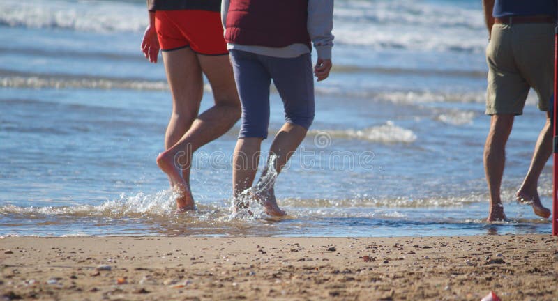 People Walking Along the Shore of the Beach in a Sun Day in Winter ...
