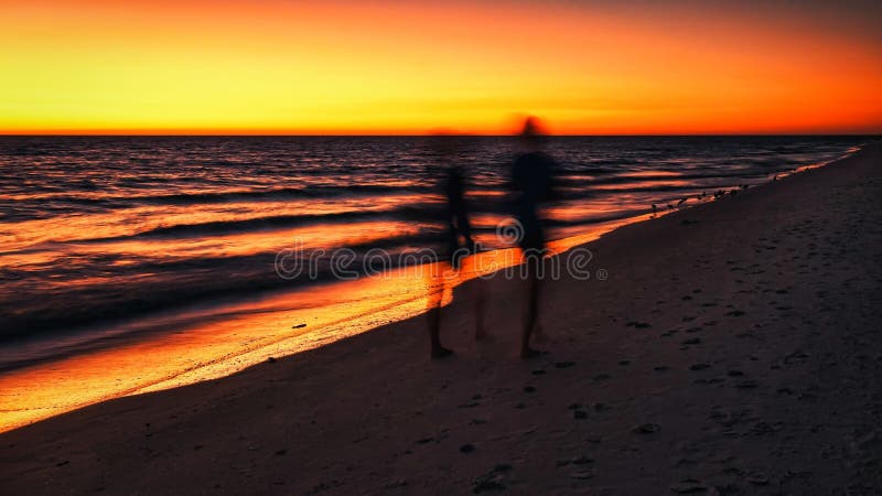 A Shadow of People Walking on the Beach Shore Stock Photo - Image of ...