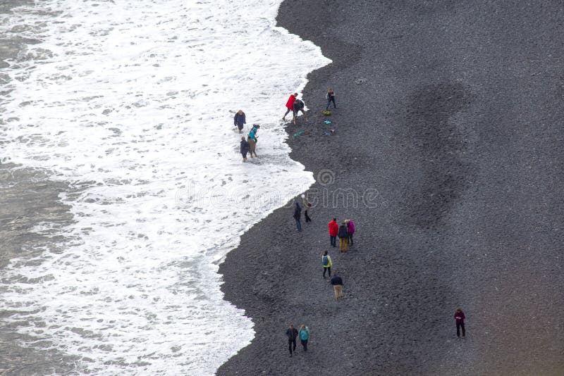 People Walking on the Beach. Waves of the Atlantic Ocean Fall on the ...