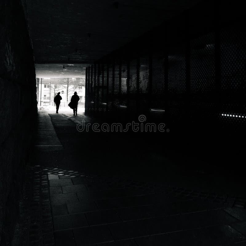 People Walking through a Dark Underground Tunnel Stock Photo - Image of ...