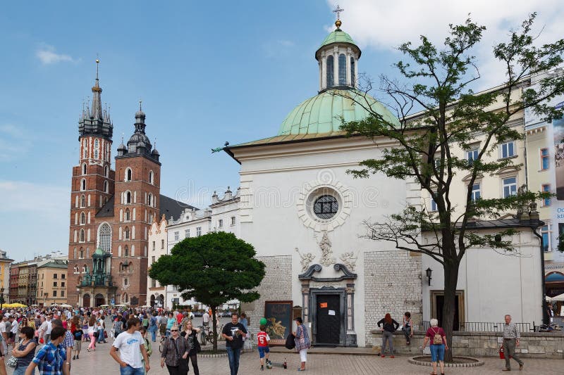 People Walking in Main Square in Krakow, Poland, with Buildings in the ...