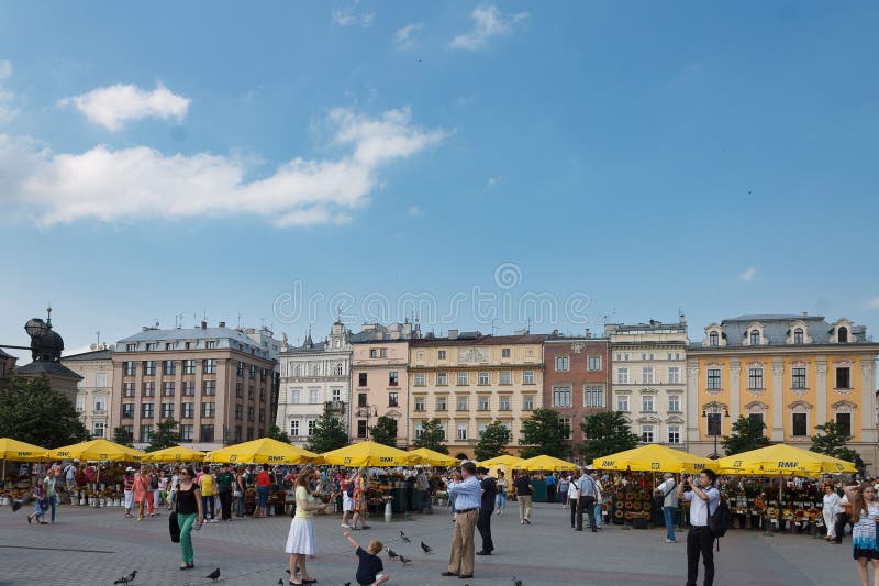 Walking in Main Square in Krakow, Poland, with Buildings in the ...