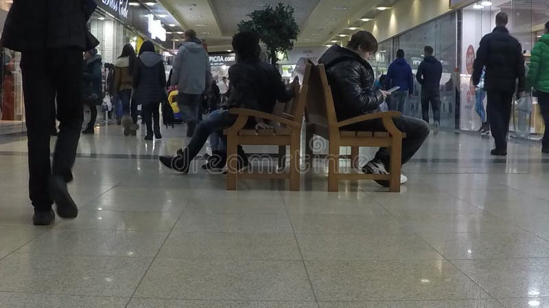 People Walking in Front of Fashion Shop in Mall. Feet of People Walking ...