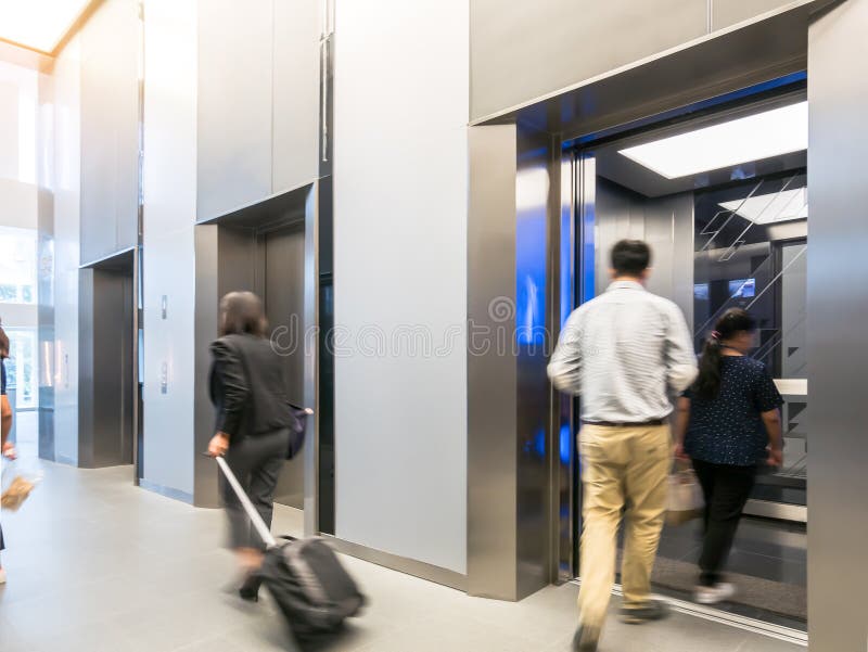 People are Walking in Office Past Elevators, Modern Steel Elevator ...