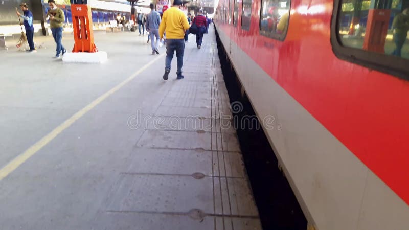 People Walking on Platform To Catch the Train at Railway Station ...