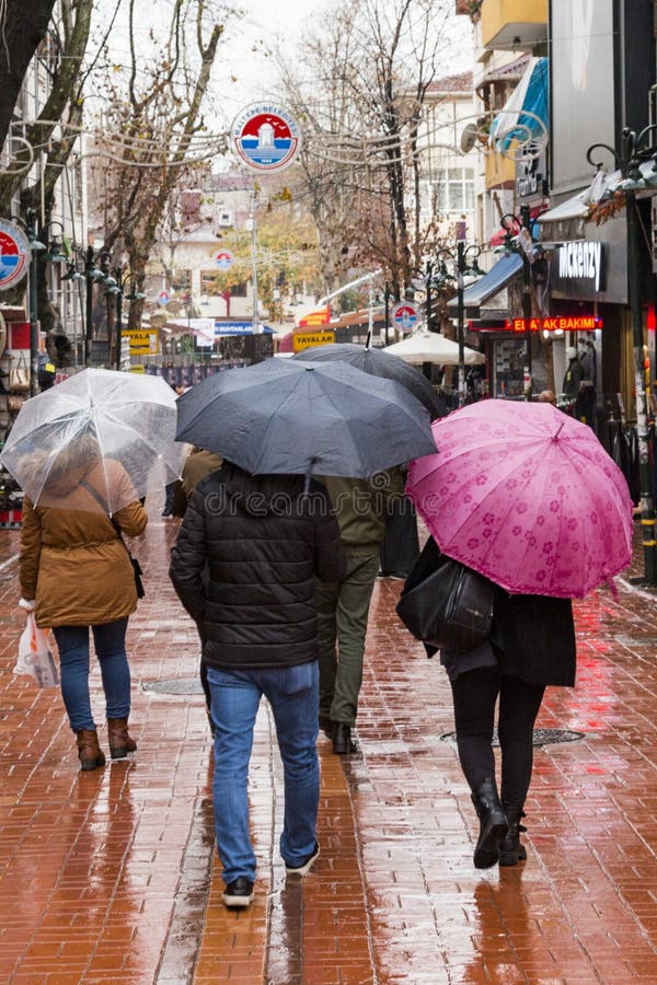 People walking in the rain editorial stock image. Image of maltepe ...