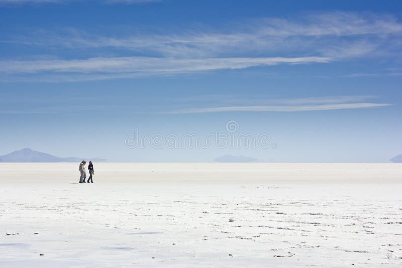 People Walking on Salt of Salar De Uyuni Stock Image - Image of clouds ...