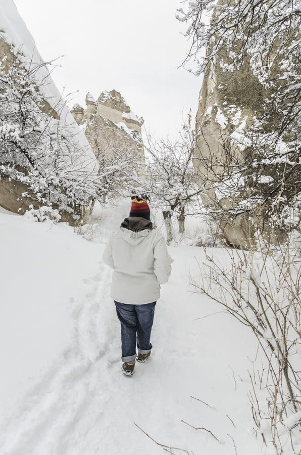 Two people walking on snow stock photo. Image of foot - 107178144