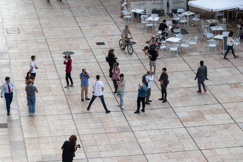 People Walking and Taking Photos on a Big Square Editorial Stock Photo ...
