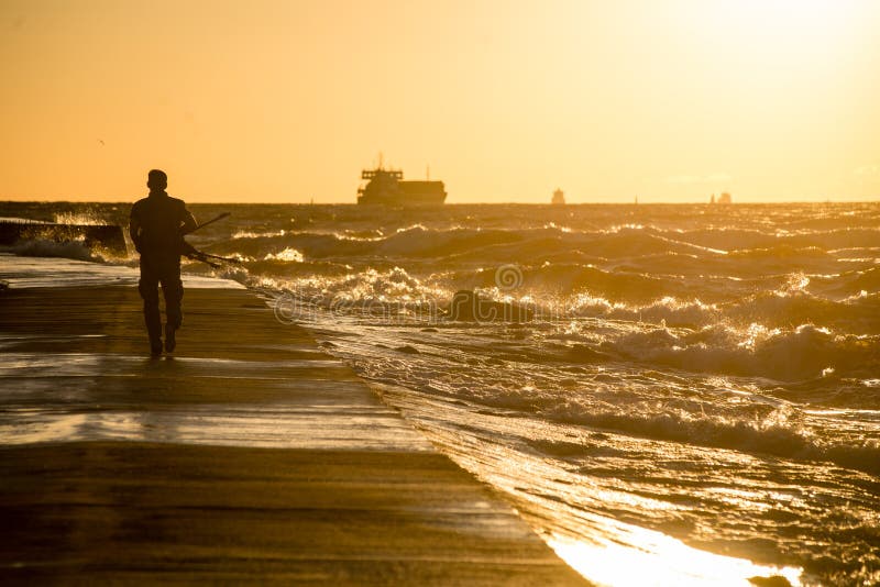 People Walking on the Wavebreaker in the Sea Stock Image - Image of ...