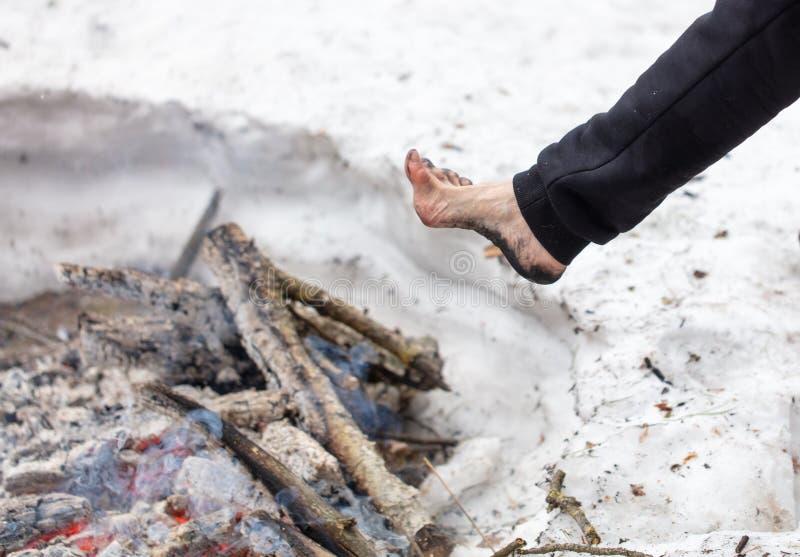 People Warm Their Feet by the Fire in Winter Stock Photo - Image of ...