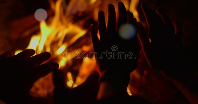 People Warm Their Hands by the Fire. Night Stock Photo - Image of ...