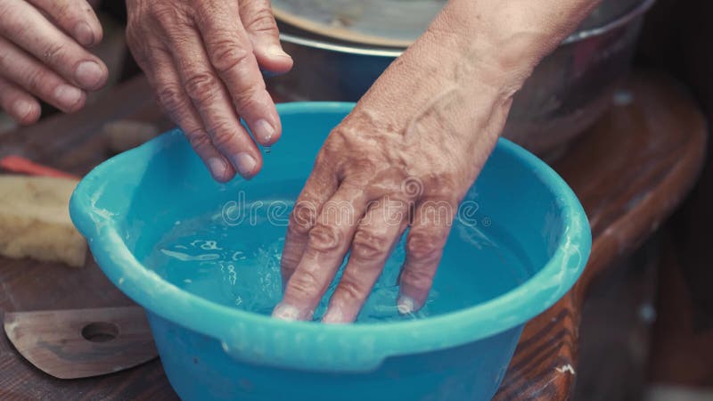 People Washing Their Hands in a Bucket Stock Footage - Video of care ...