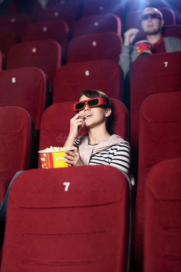 People watching a movie stock image. Image of brunette - 26418989