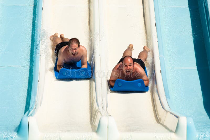 Aqua Park Fun - Man Enjoying a Water Tube Ride Stock Photo - Image of ...