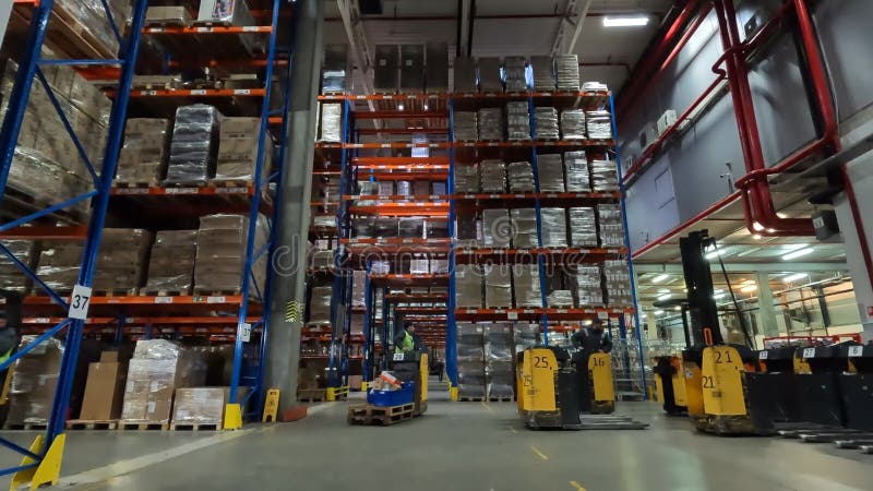 People Work in a Large Warehouse. Timelapse in a Modern Warehouse ...