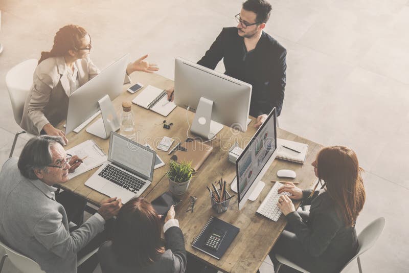 People Working Around a Table Stock Photo - Image of team, colleagues ...