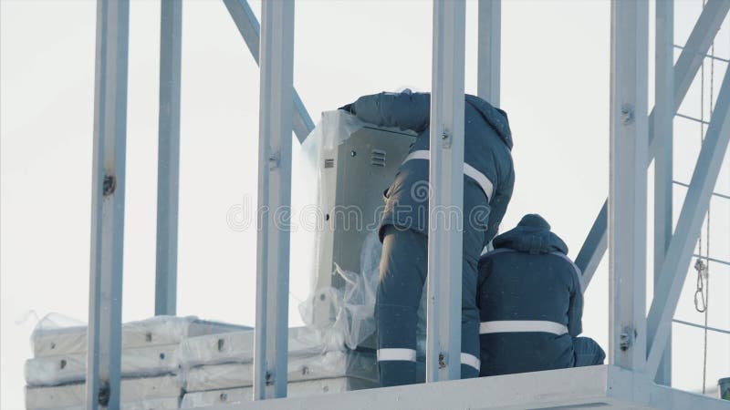 People Working Building New Big Billboard. Worker Repairing Billboard ... People Working Building New Big Billboard. Worker Repairing Billboard ...