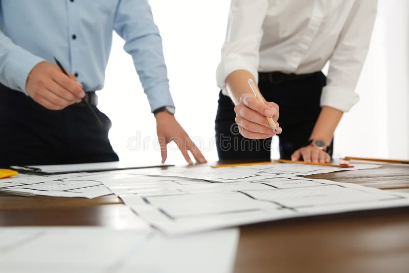 People Working with Construction Drawings at Table, Closeup Stock Image ...