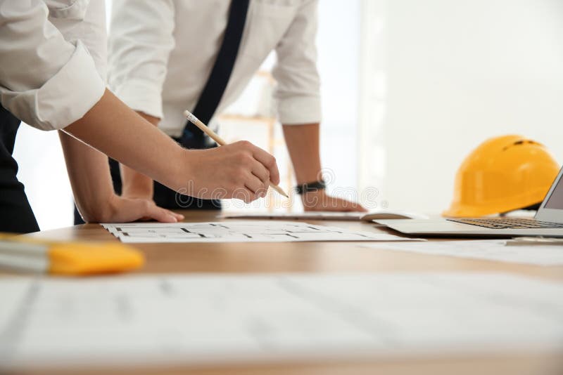 People Working with Construction Drawings at Table, Closeup Stock Image ...