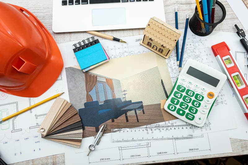 People Working with Construction Drawings and Tools at a Wooden Table ...