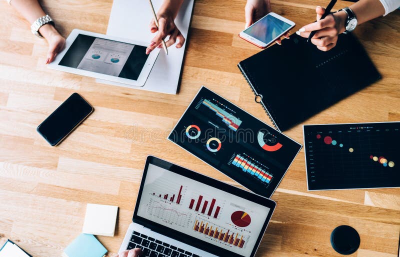 People Working with Electronic Devices and Papers Stock Photo - Image ...