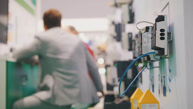 People Working in High-tech Industry Room Near Electronic Equipment ...