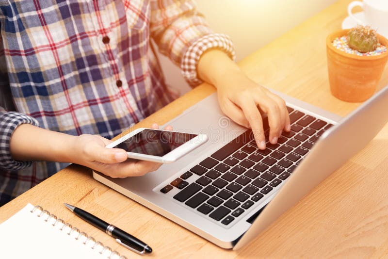 People Working from Home Using Smart Phone and Notebook Laptop Computer ...