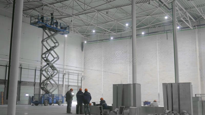 People Working in Large Modern Warehouse Under Stock Image - Image of ...