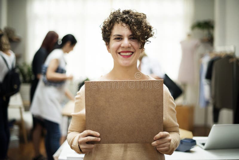 People Working in Office Holding Board Stock Image - Image of paper ...