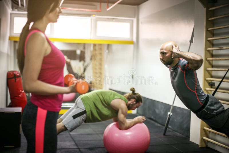 People Working Out in the Gym. Stock Image - Image of male, exercise ...