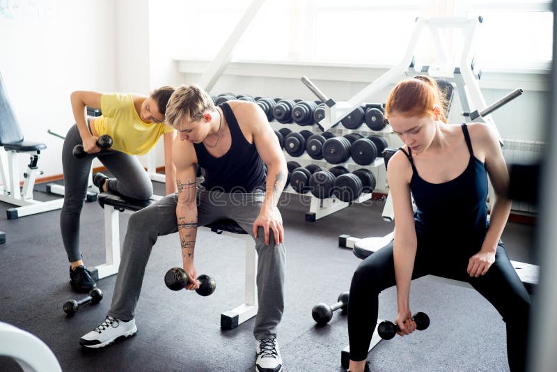 People working out at gym stock photo. Image of muscles - 93493424