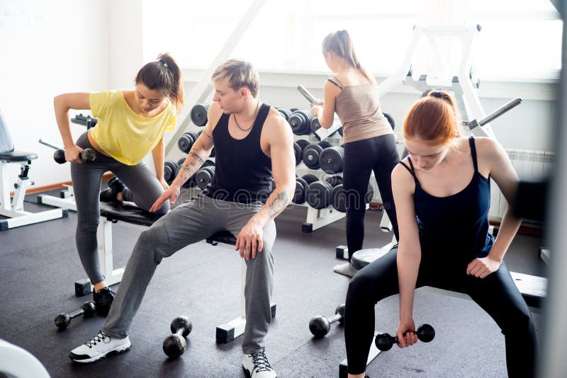 People working out at gym stock photo. Image of person - 93493510